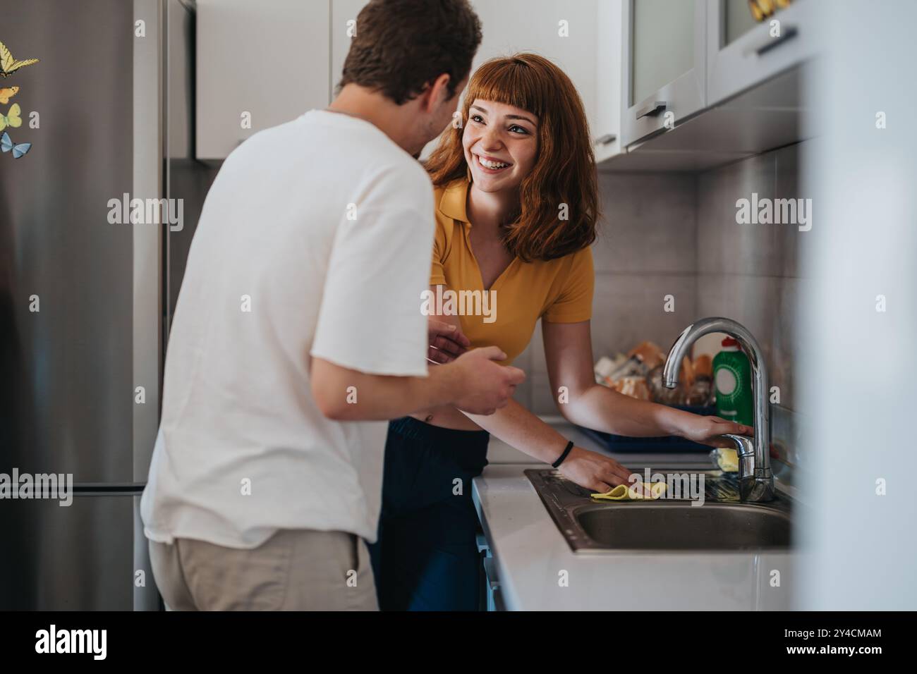 Cheerful couple doing dishes hi-res stock photography and images - Alamy