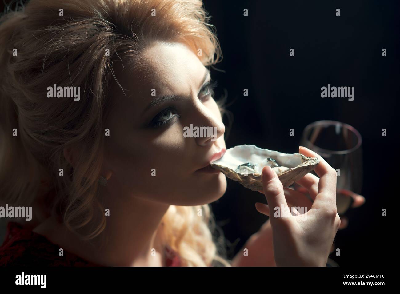 Oysters shell close up. Woman eat oyster. Oyster dinner in restaurant ...