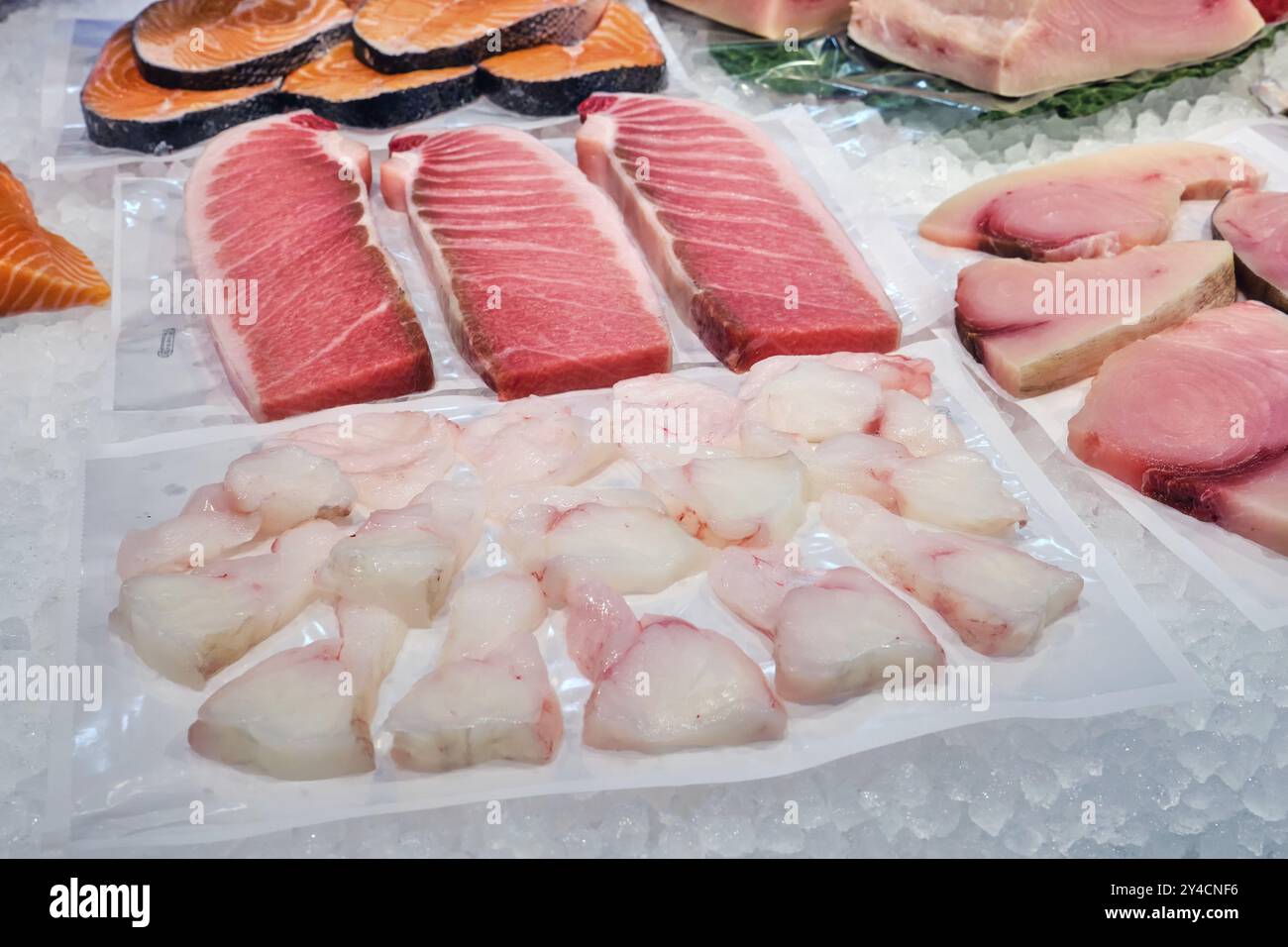 Different types of fish fillets for sale at a market in Spain Stock ...