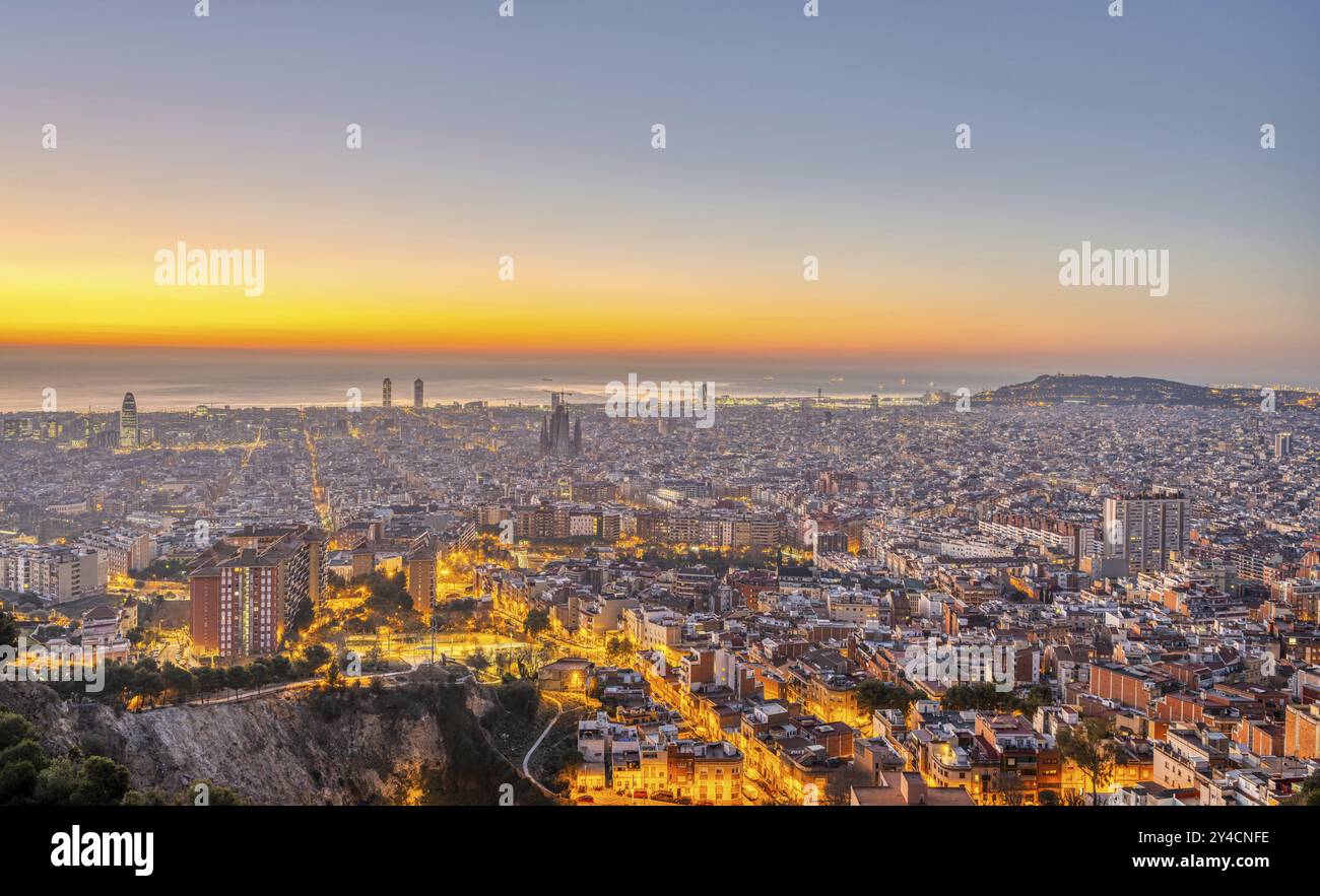 The skyline of Barcelona in Spain in front of sunrise Stock Photo - Alamy