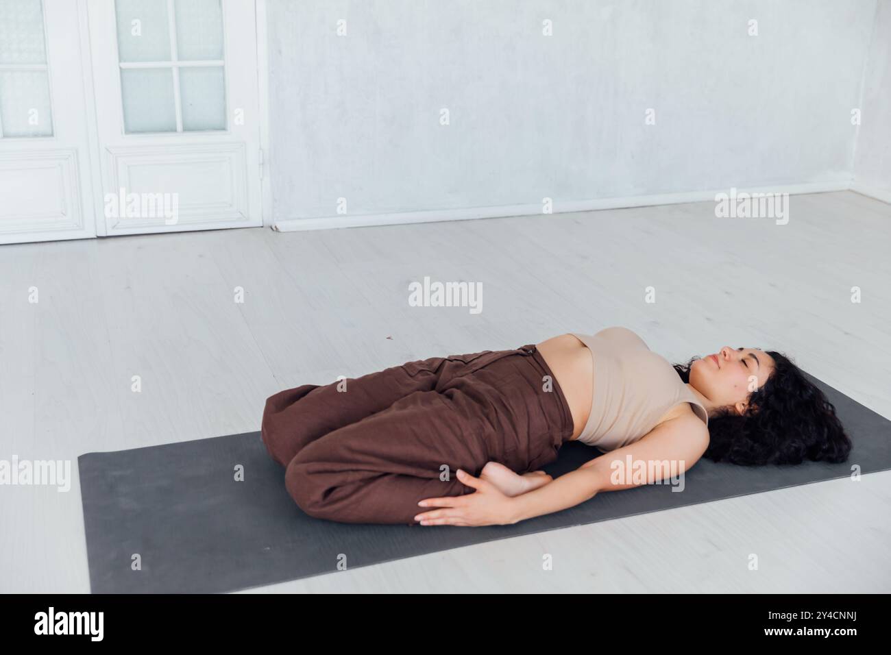 Young Yogi Woman Practicing Yoga Concept Doing One Legged King Pigeon