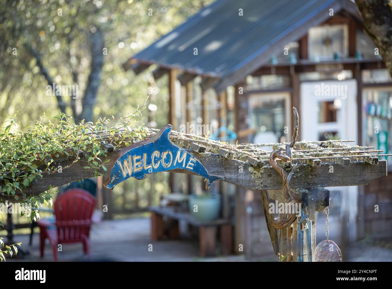 A scene from the backyard, focused on the welcome sign with the ...
