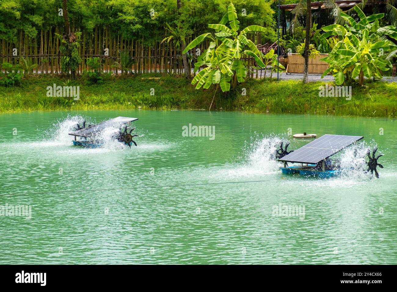 Solar-powered water aerator systems with rotating paddles in a pond for ...