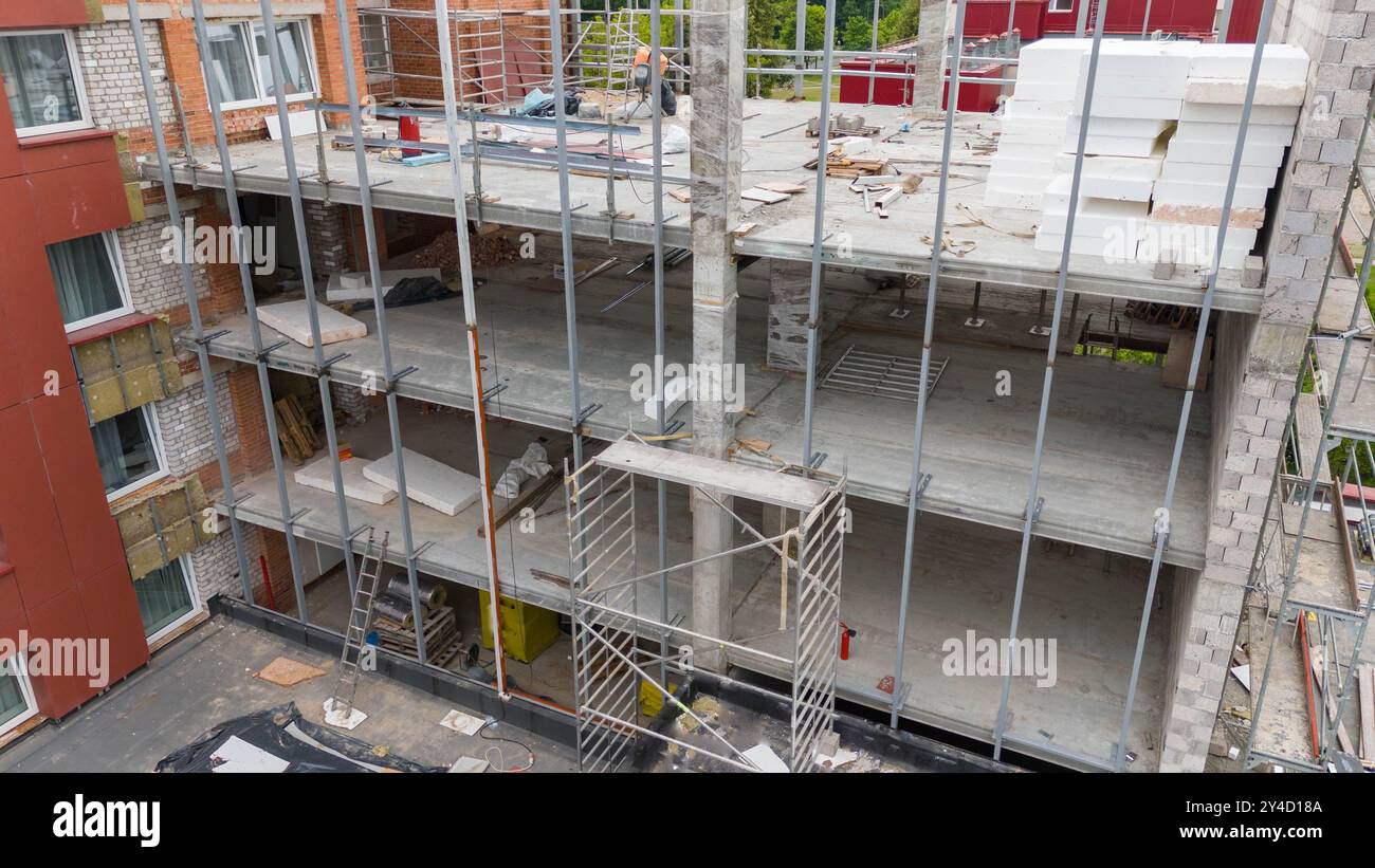 Construction site of a multi-story building with exposed floors and ...