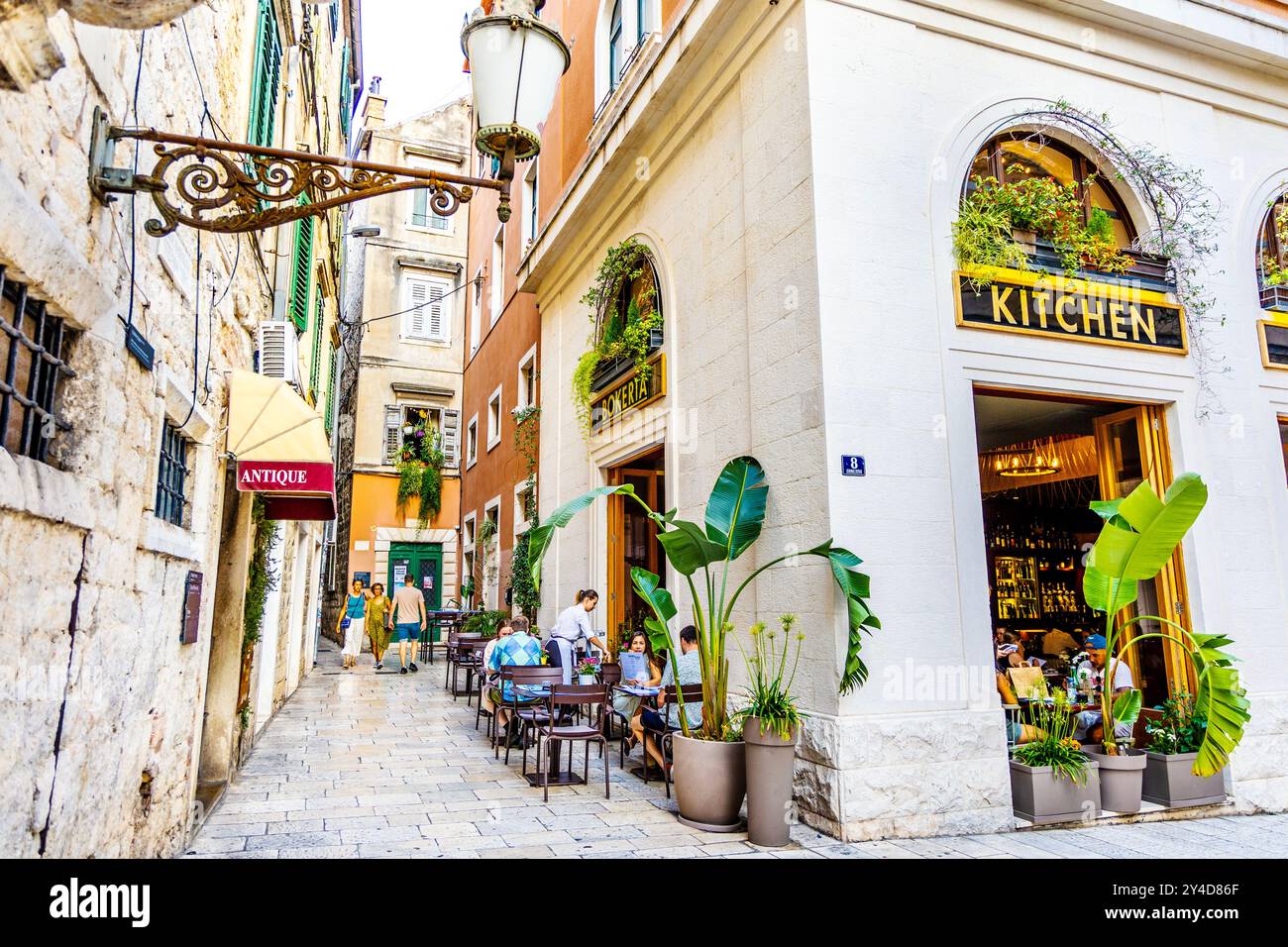 Narrow alley in the old town and exterior of Bokeria Kitchen & Wine ...