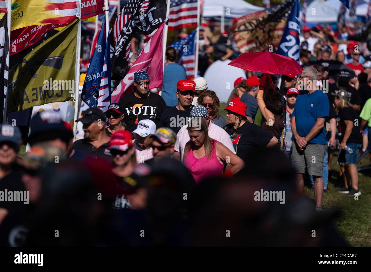 People wait in line to attend a town hall with Republican presidential ...