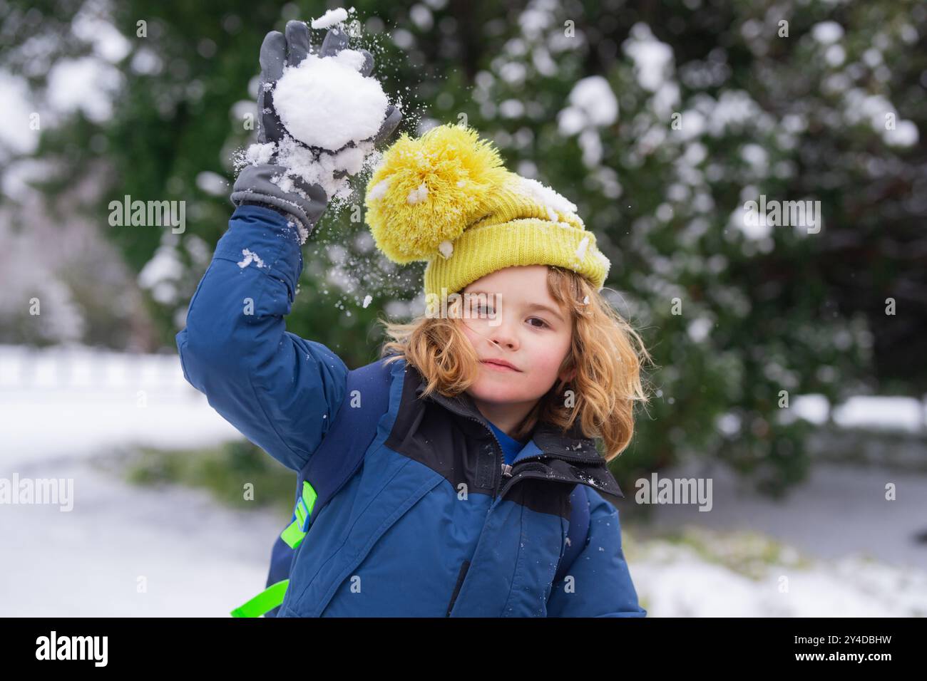 Kid snowball fight. Kid playing with snow ball in winter. Family ...