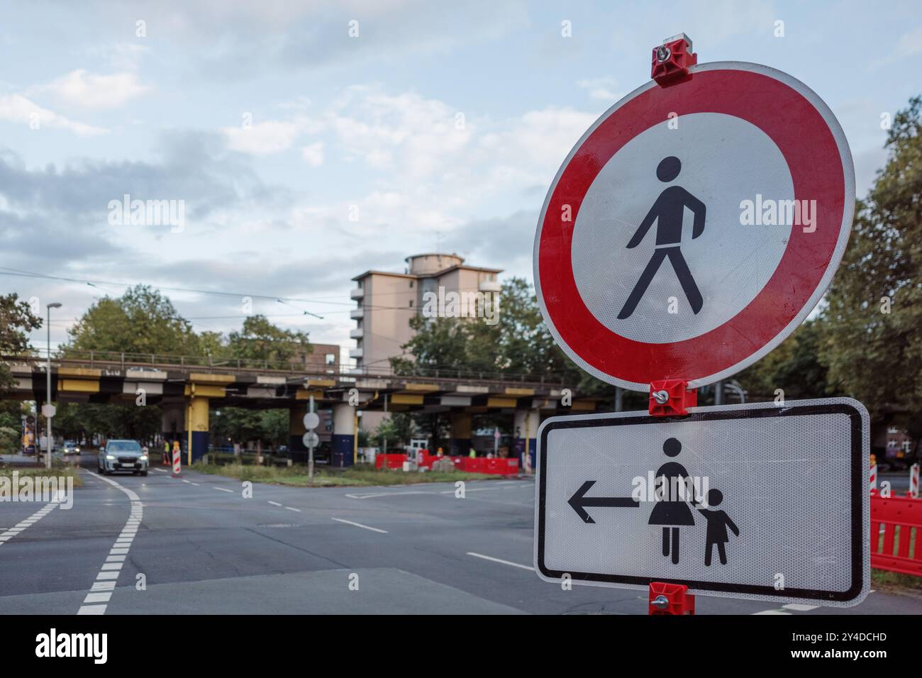 A close-up view of a pedestrian traffic sign at a city intersection ...