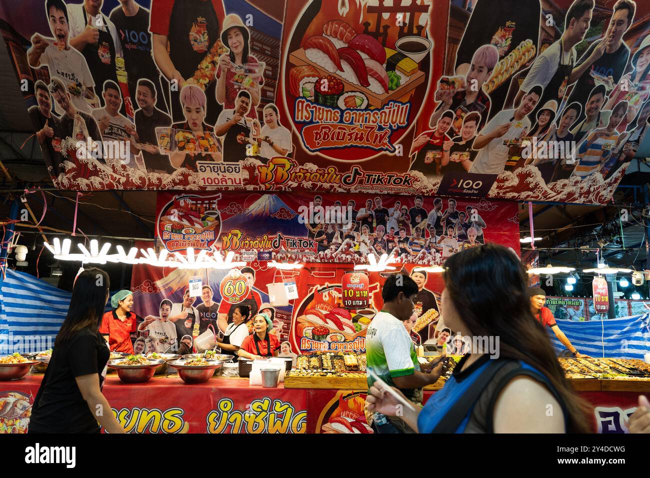 People shop at the food and merchandise fair at Uttaradit province, 488 ...