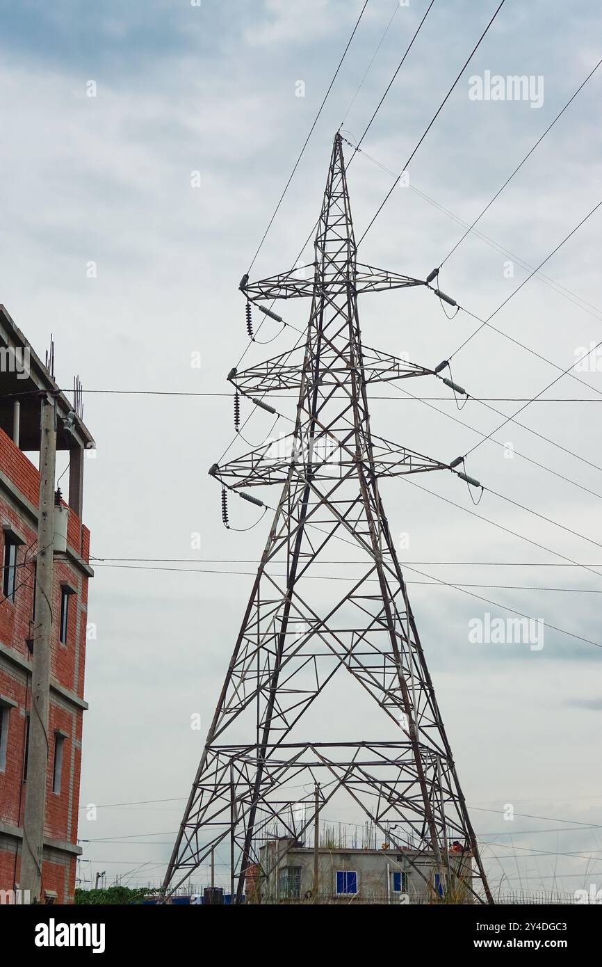 Transmission tower in a developing area Stock Photo - Alamy
