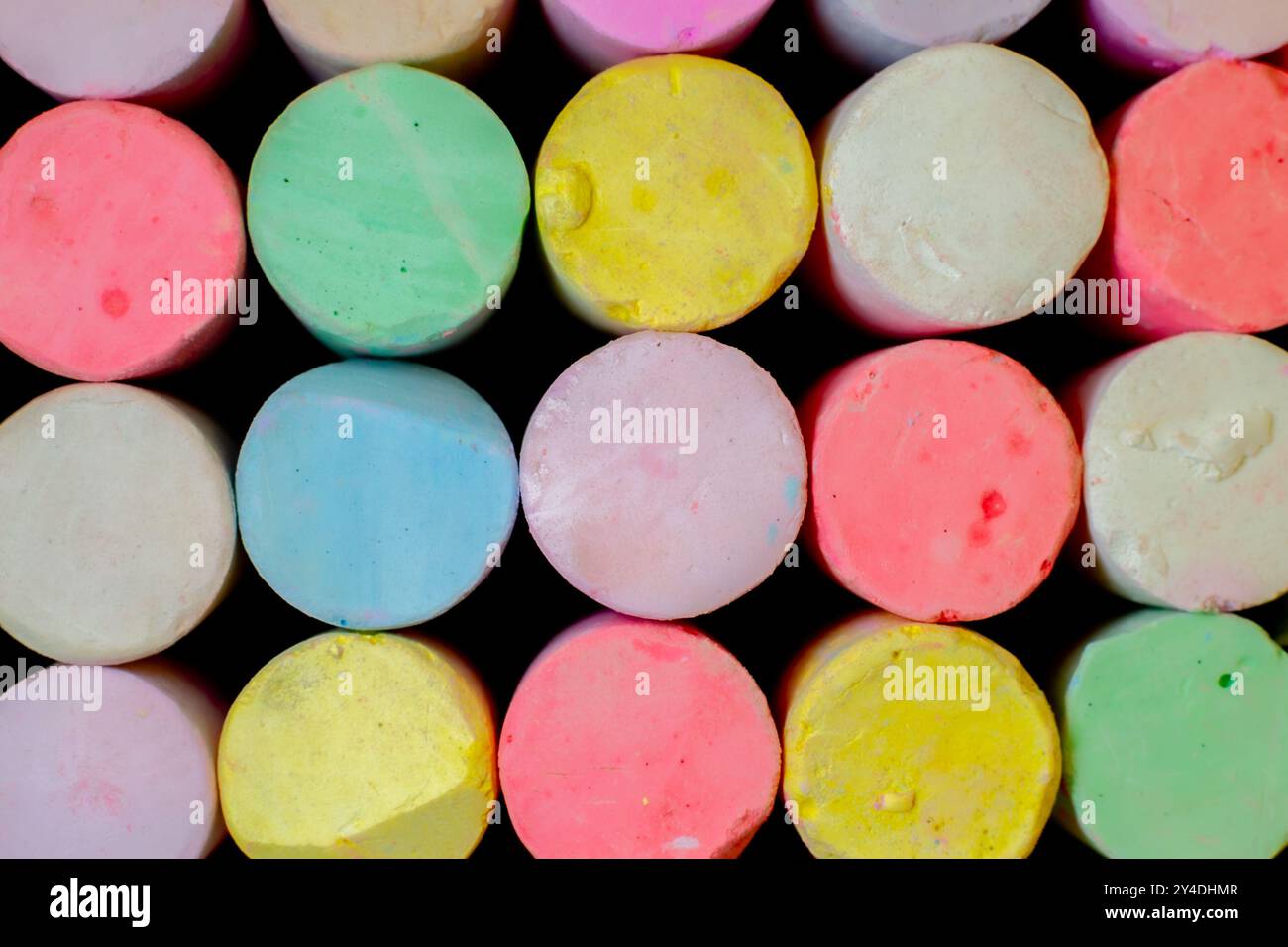 Close-up from above of a group of colored chalks for painting on the ...