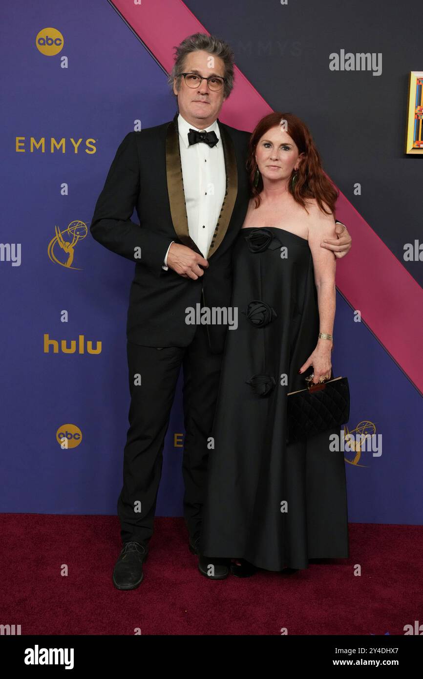 Paul Simms, left, and Beth Simms and pose for a Red Carpet portrait at ...