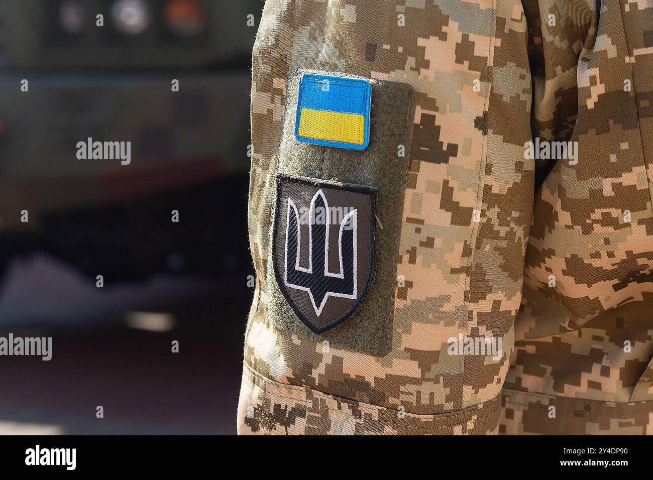 Military badge of ukrainian army with trident and yellow-blue flag on ...
