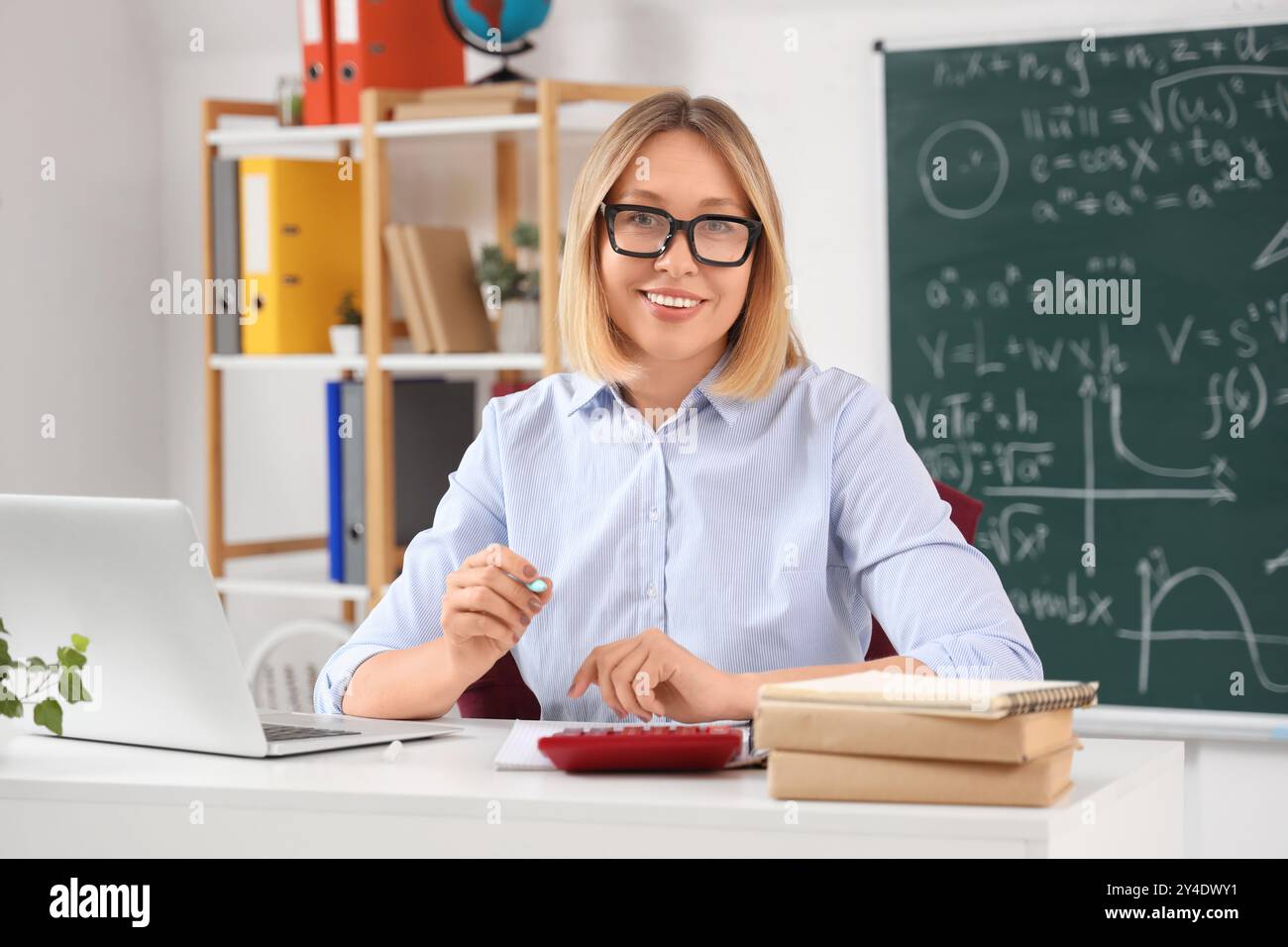 Female teacher table books hi-res stock photography and images - Alamy