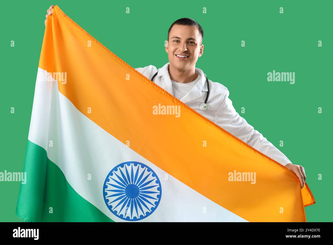 Male doctor with flag of India on green background. National Doctor's ...