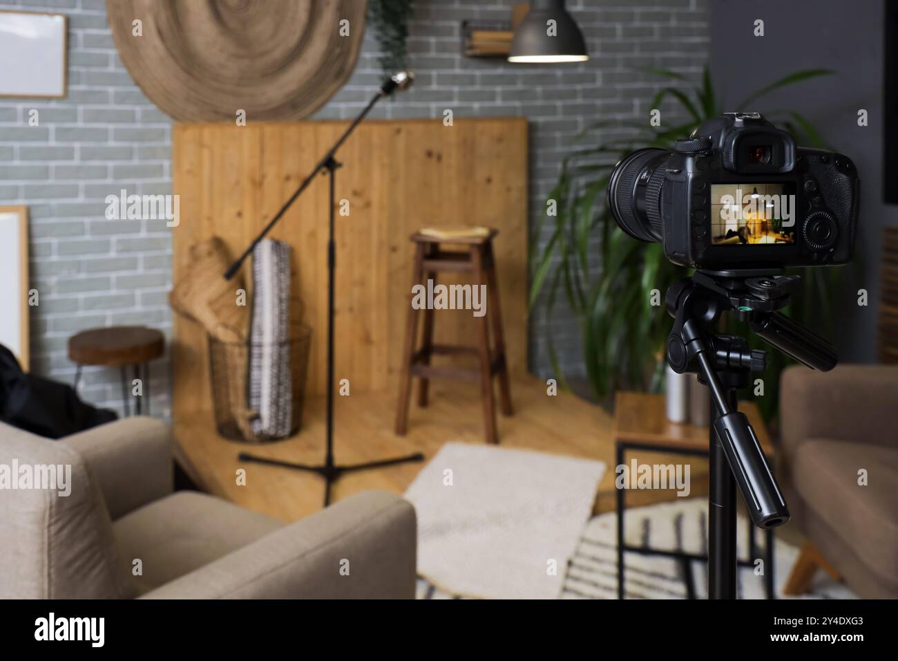 View of standup scene with stool and microphone on camera screen ...