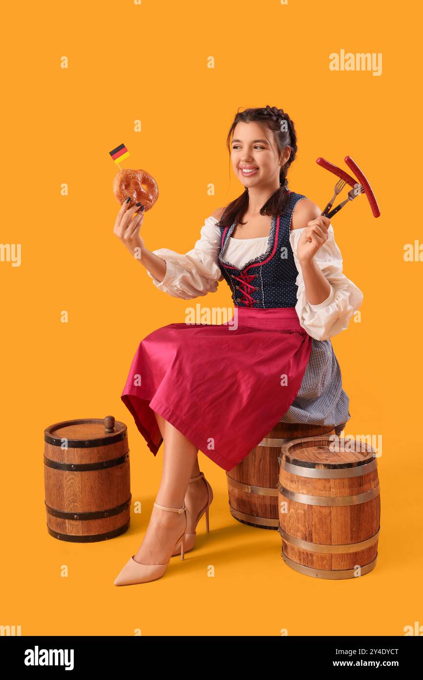 Young Octoberfest waitress with traditional German food sitting on ...