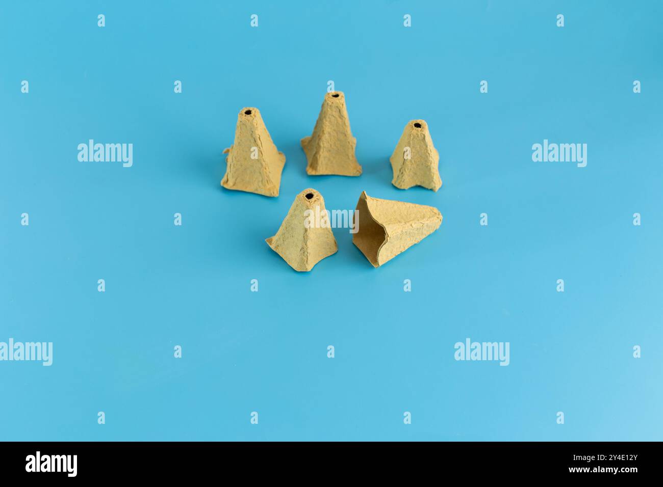 broken pieces of recycle empty egg carton box on a plain background ...