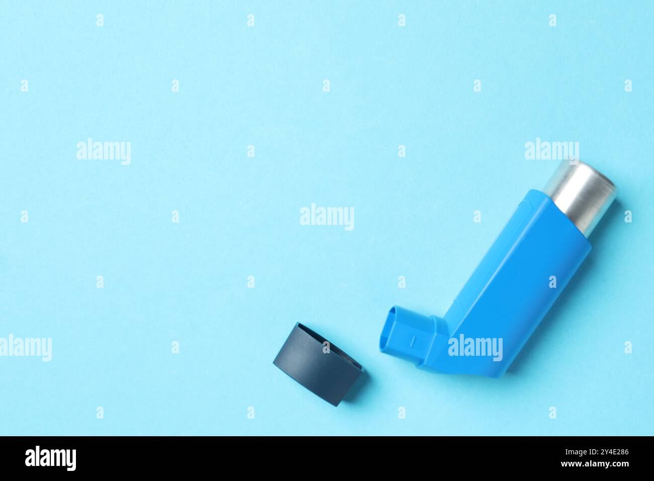 Asthma inhaler on light blue background, top view. Space for text Stock ...
