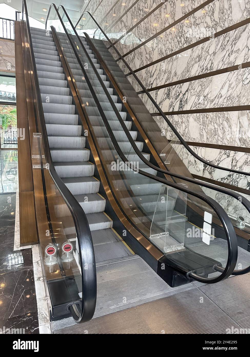 Modern escalators with handrails in shopping mall Stock Photo - Alamy