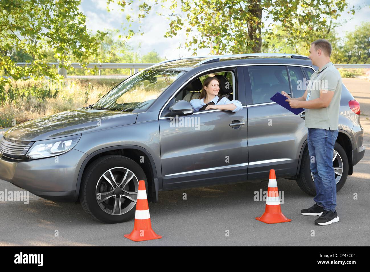Woman passing maneuverability driving test on track Stock Photo - Alamy