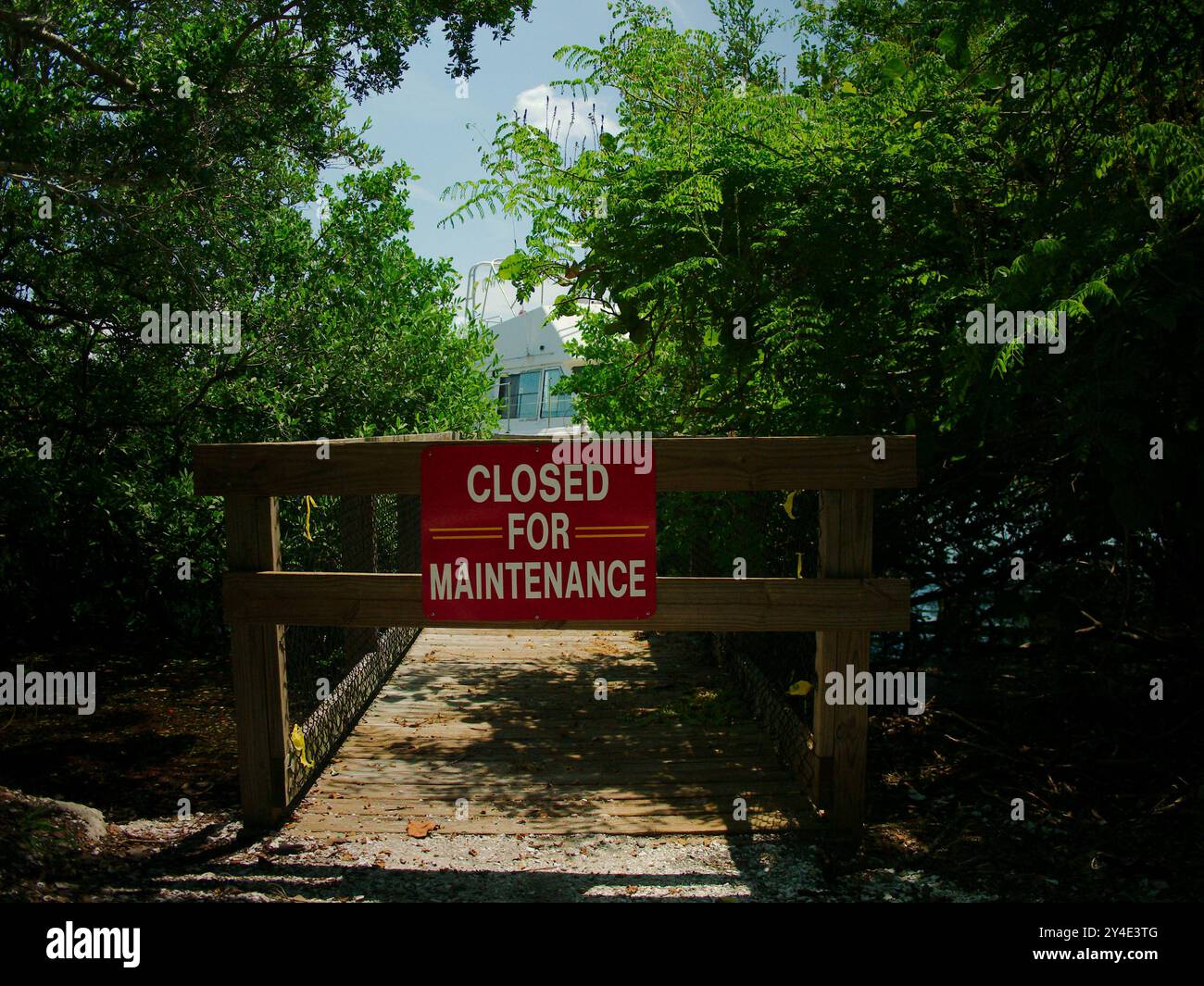 Area closed sign. Sign on park boardwalk closed for repairs. Looking ...