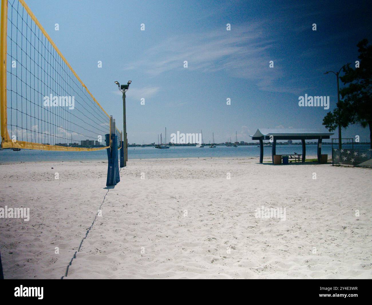 Wide view with yellow edge volleyball net on the left with a view out ...