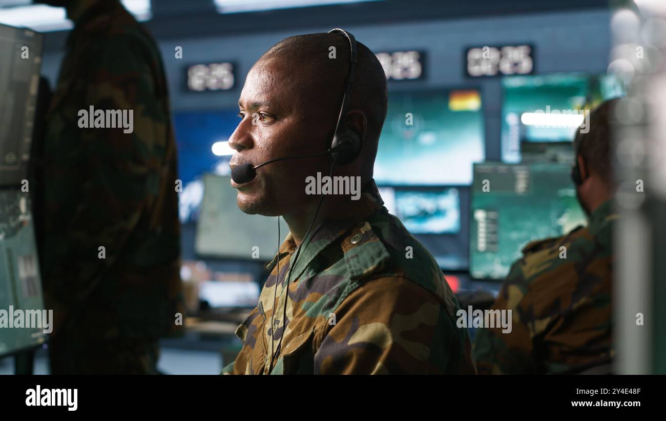 Army telecommunication systems operator using radio gear, providing ...