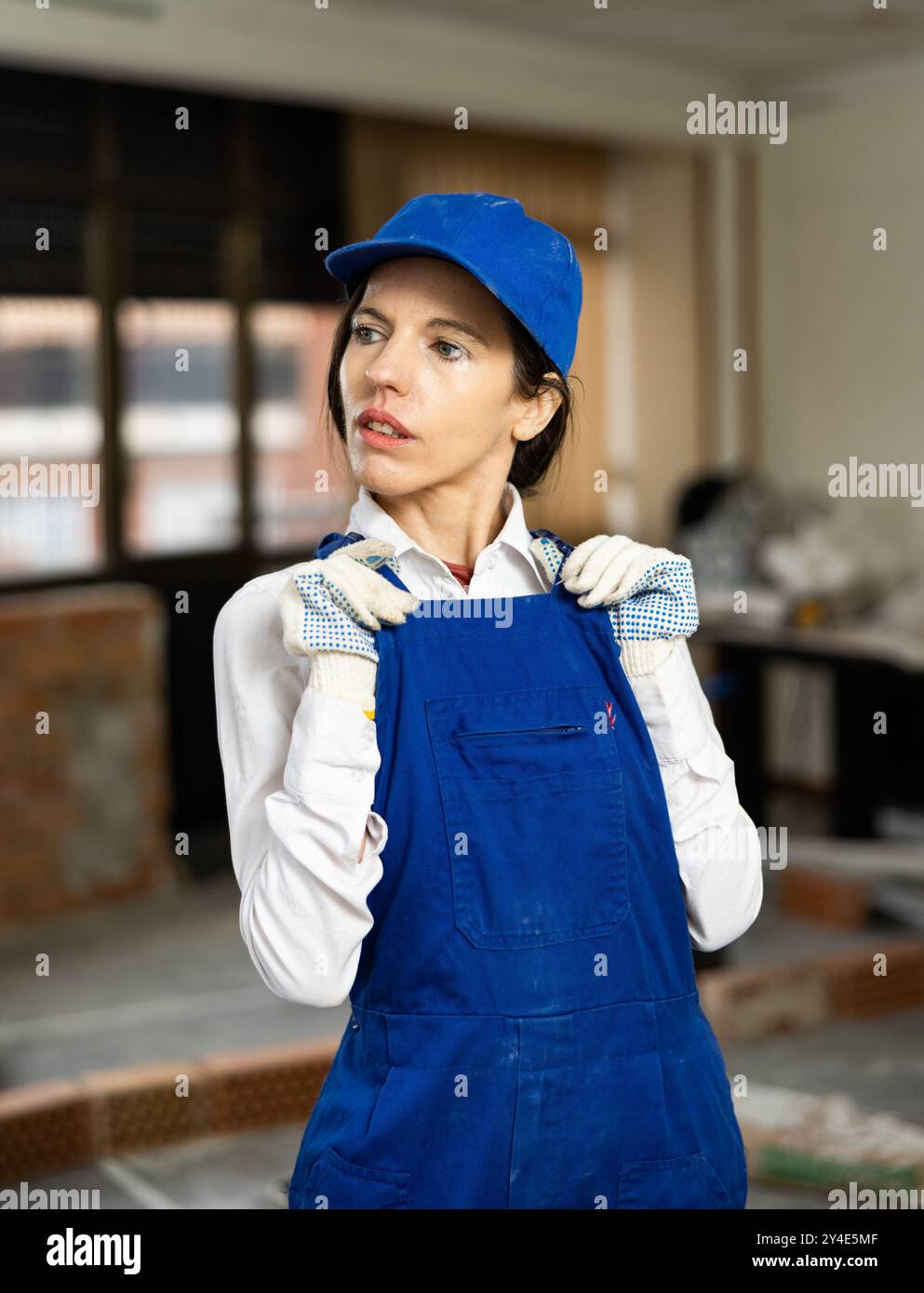 Confident female builder posing at construction site indoors Stock ...