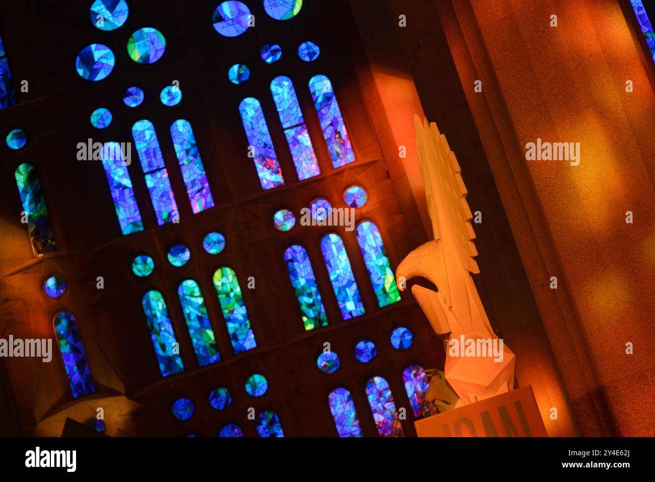 Interior of the church angel sculpture stained windows Stock Photo - Alamy