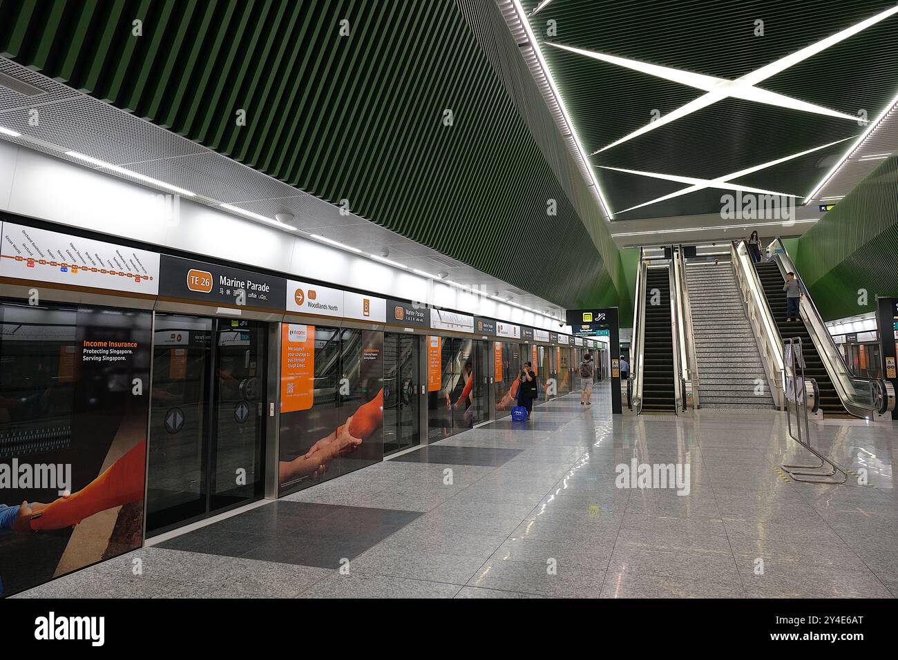 Platforms of Marine Parade MRT station, with green panel claddings and ...