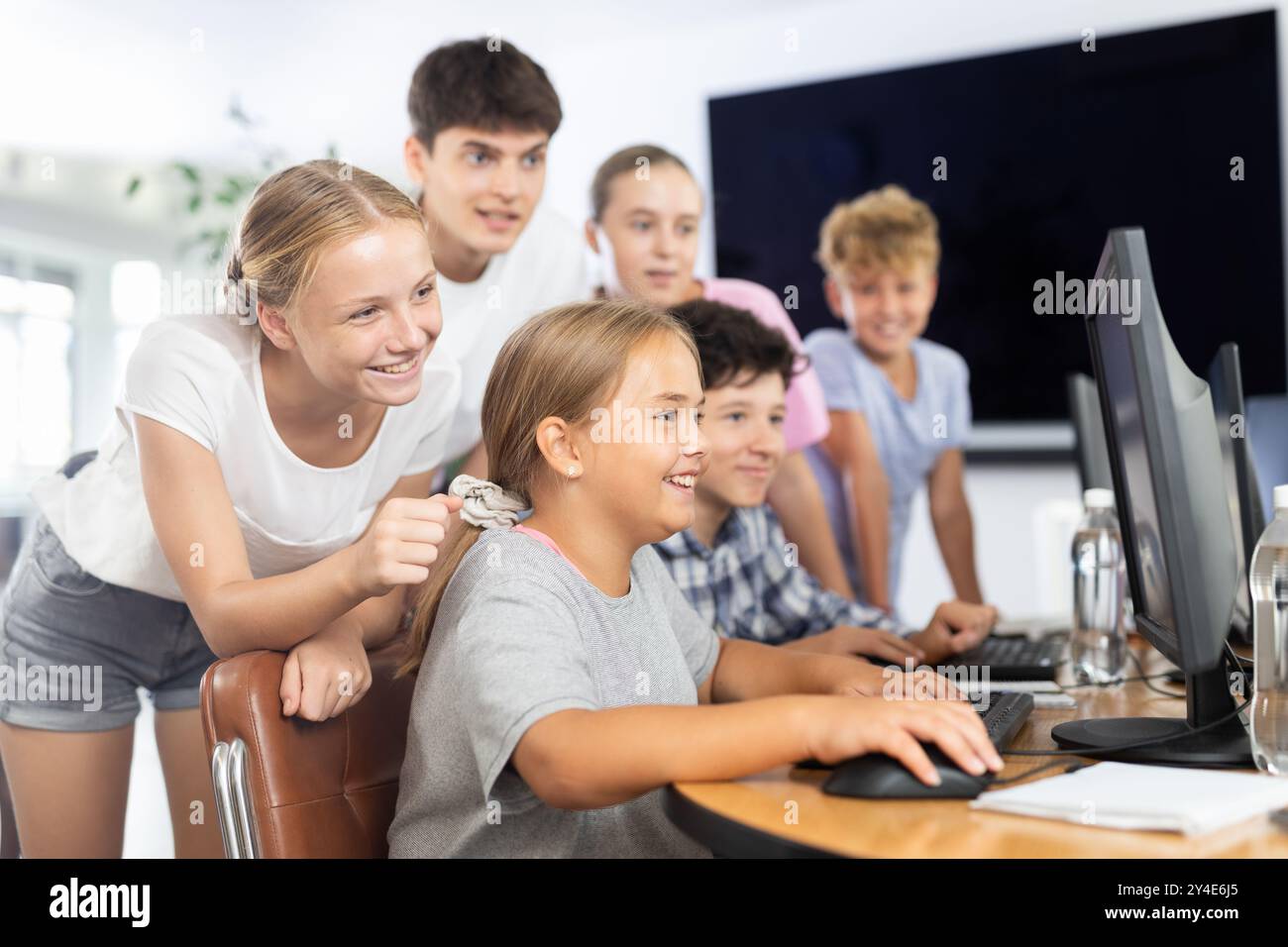 Group of students working at computer in classroom Stock Photo - Alamy