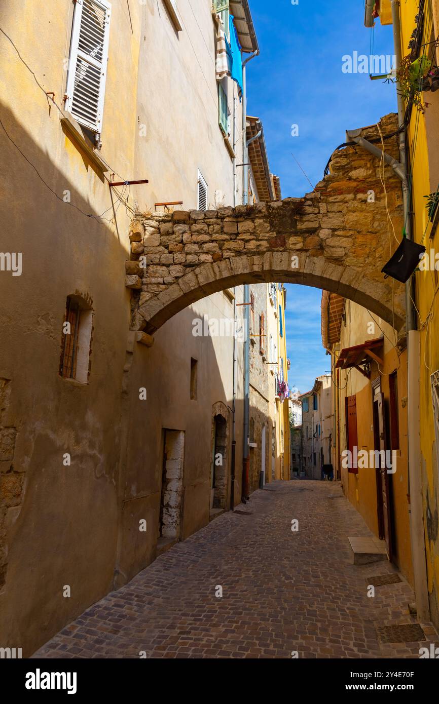 Traditional old houses on narrow winding streets in french town of ...