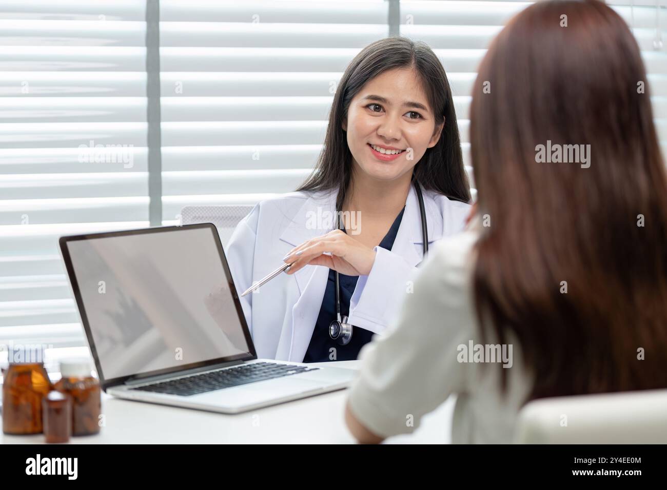 Doctor Using Digital Tools to Explain Treatment Plans to Patient Stock ...