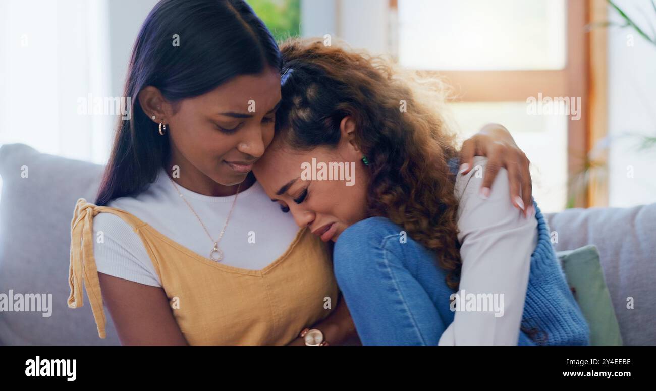 Women, friends and crying with hug on sofa of breakup depression ...