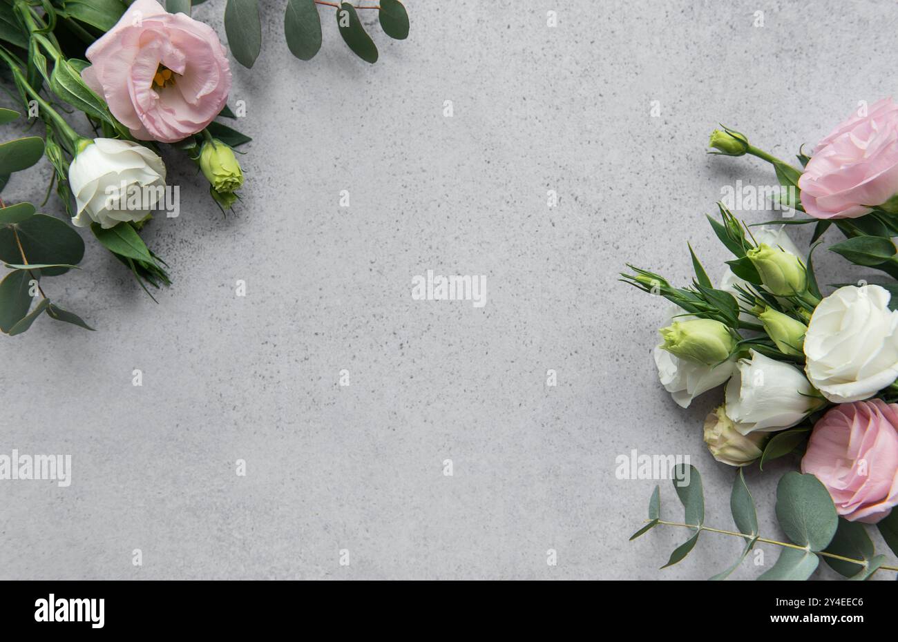 A beautiful assortment of pink, white, and cream flowers are artfully ...