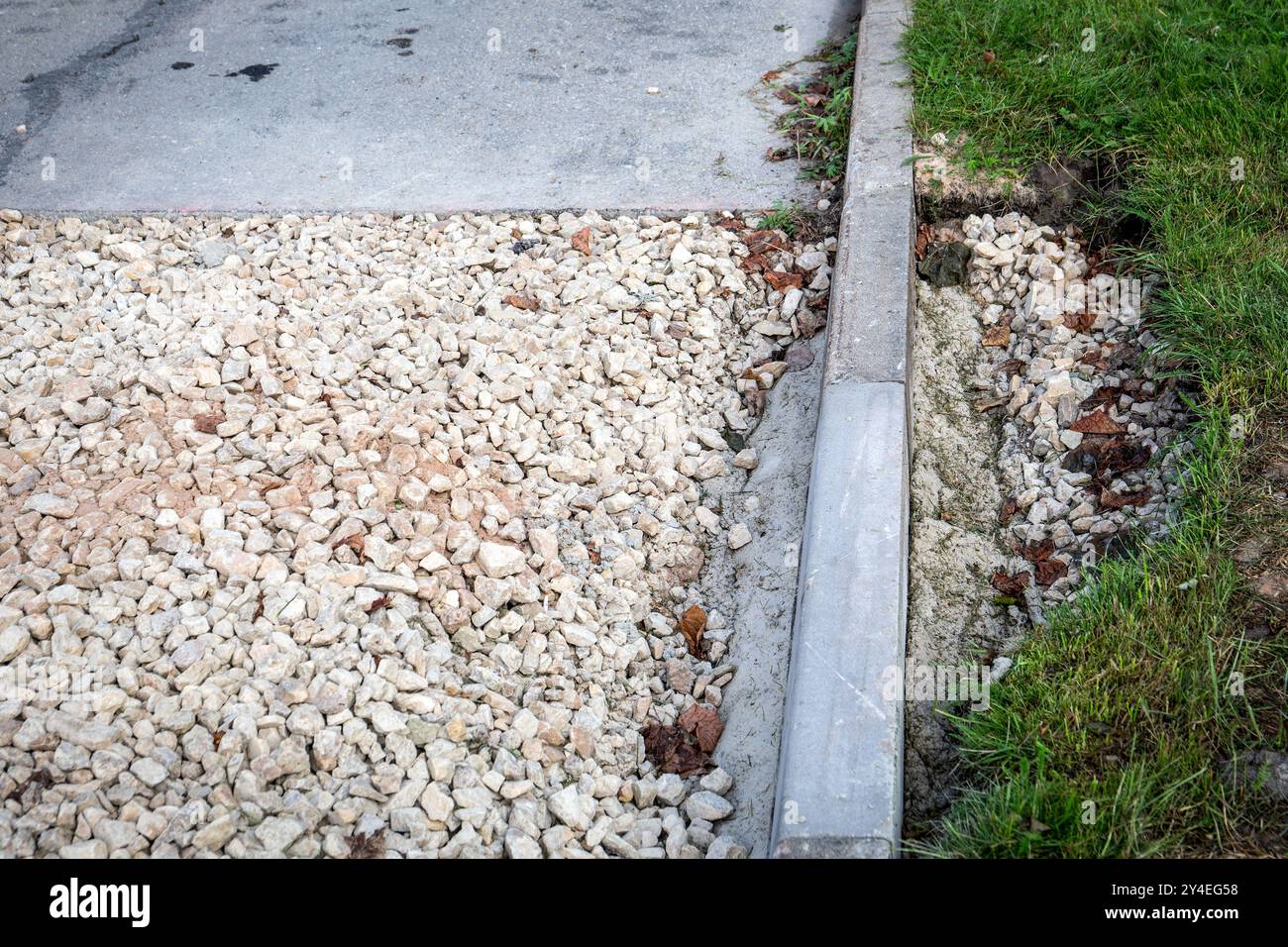 Stone chips on the pavement, road construction stage Stock Photo - Alamy