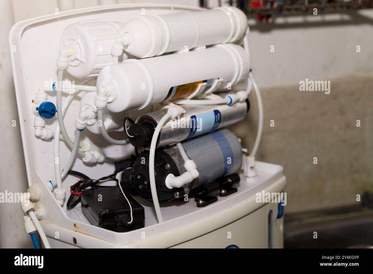 Inside view of a domestic water purifier, revealing complex filters and ...