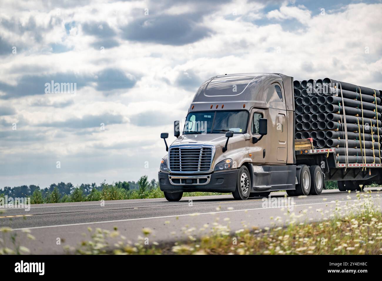 Industrial long hauler carrier beige big rig semi truck with step deck ...