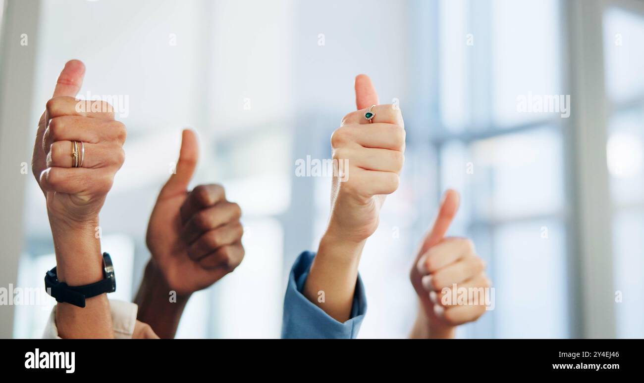 Employees, hands and thumbs up in office for approval, team support and ...
