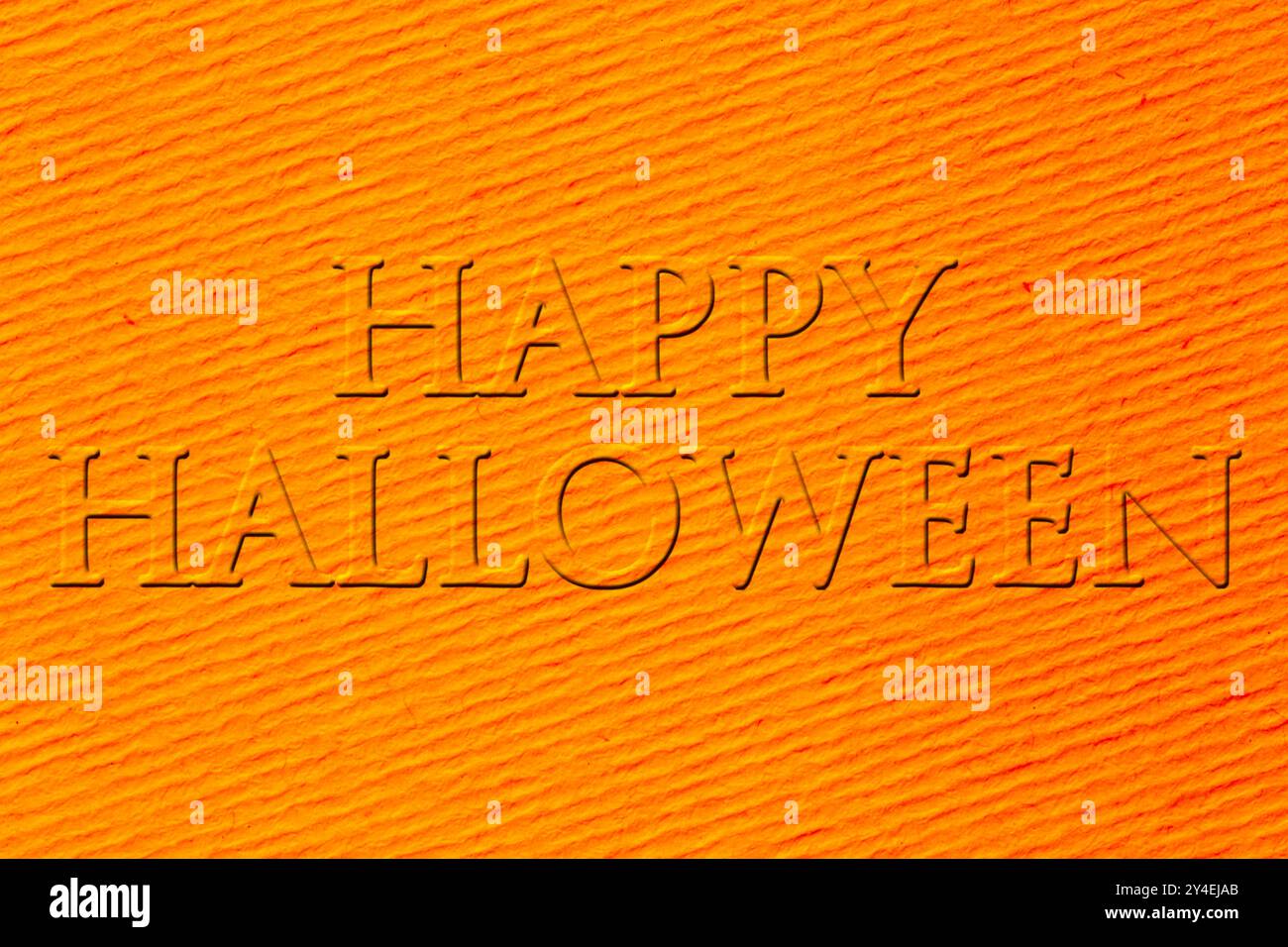 Happy Halloween congratulation message on striped orange paper Stock ...