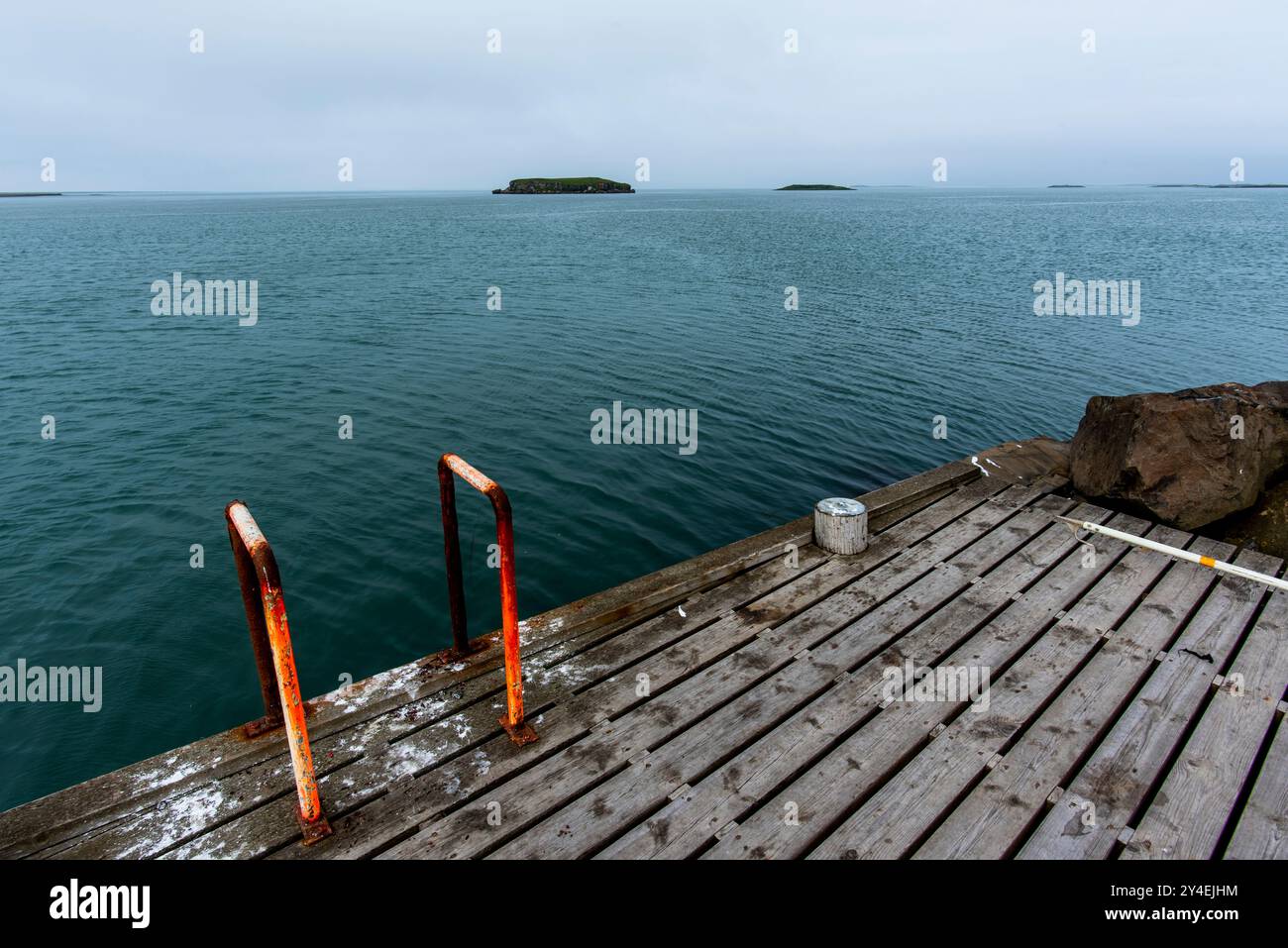 old wooden jetty with rusty ladder Stock Photo - Alamy