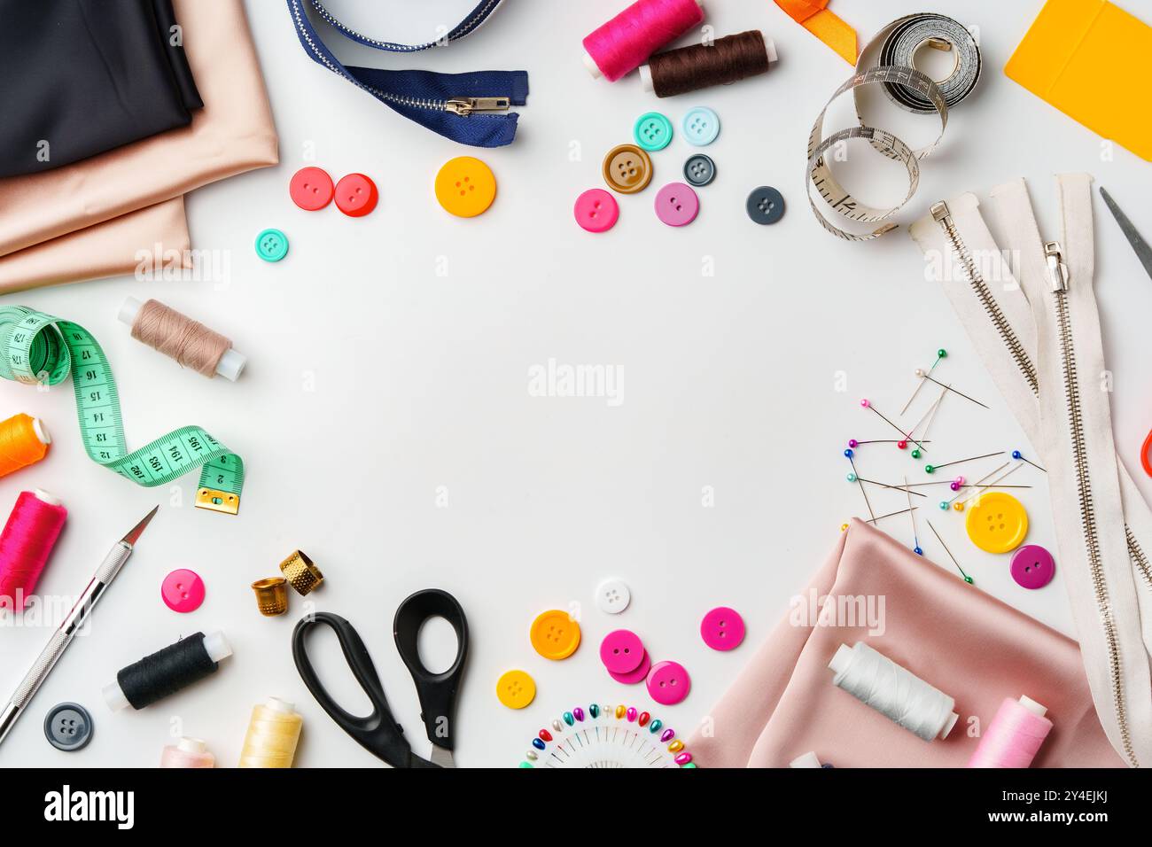 Crafting supplies arranged on a table with fabric, thread and buttons ...