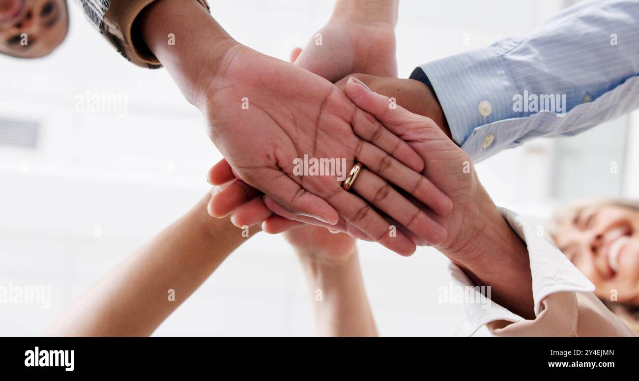 Business people, palm and stack in huddle for teamwork, office support and motivation for goals ...