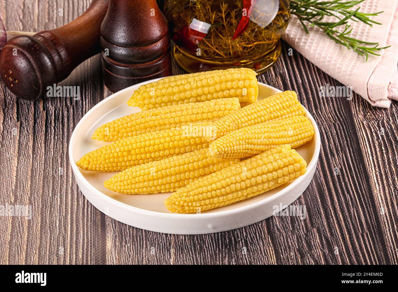 Canned baby mini corn cob in the plate Stock Photo - Alamy