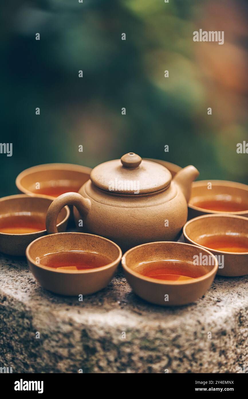 Traditional tea ceremony with a clay teapot and cups, celebrating Asian ...
