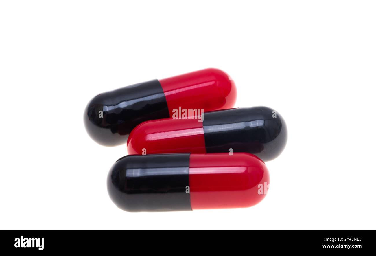 red black capsules isolated on white background Stock Photo - Alamy