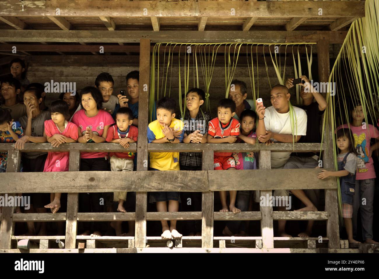 People watching a welcome ceremony during an ecotourism event at the ...