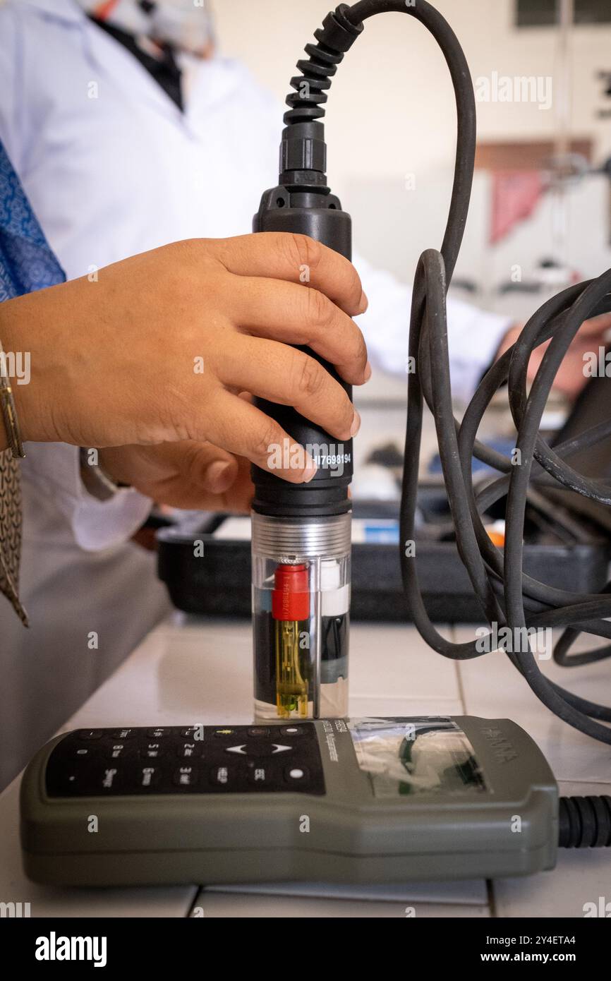 Testing the quality of water from an experimental wastewater treatment ...