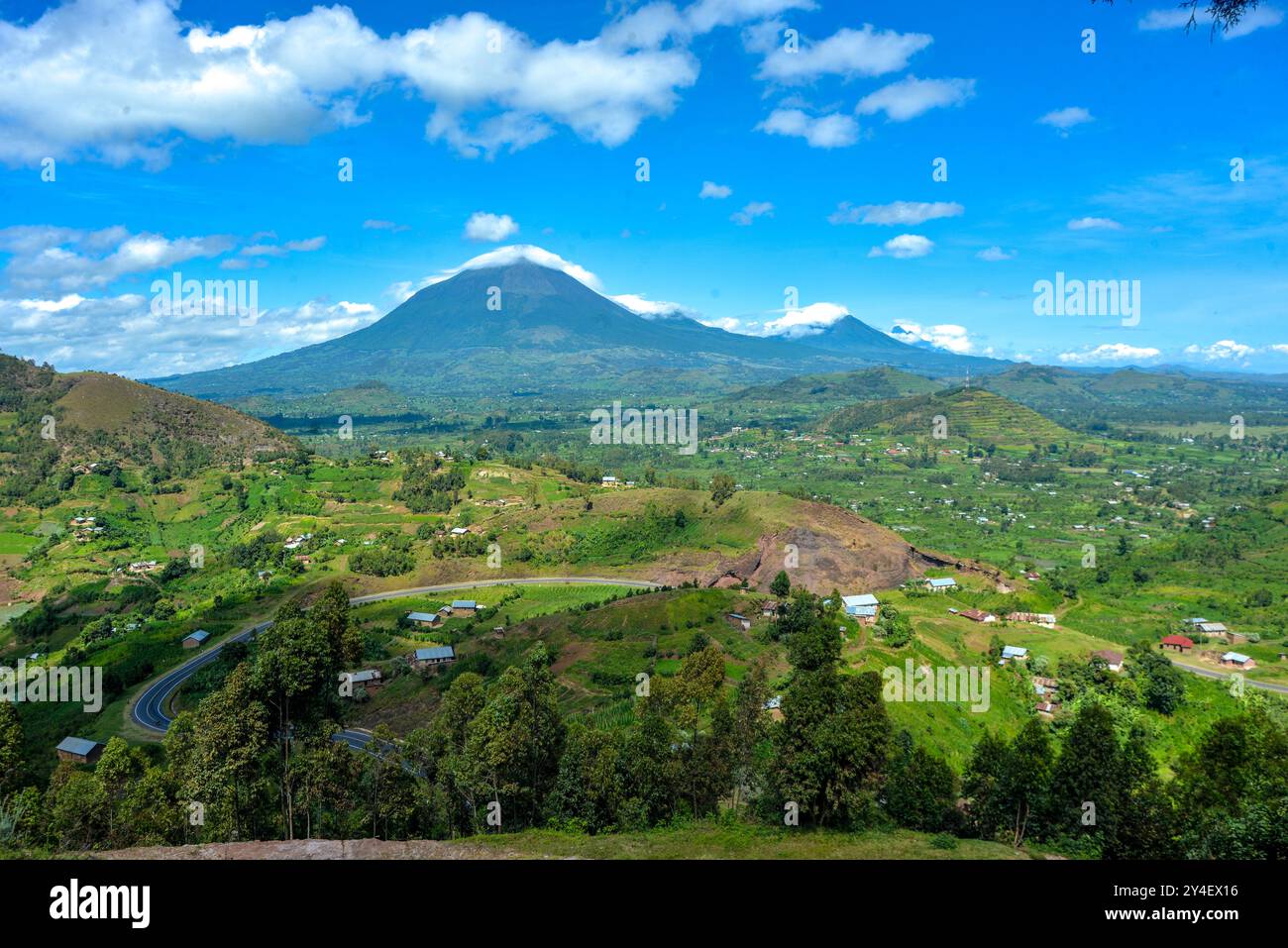 A landscape photo of Kisoro Uganda showing the three peaks of the ...